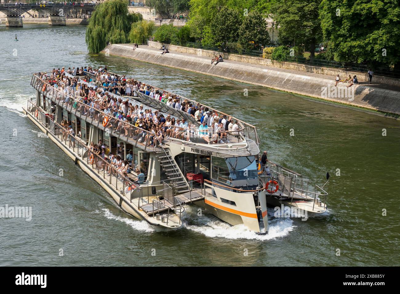 Large group of tourists, on the boat deck of one of the famous bateau ...