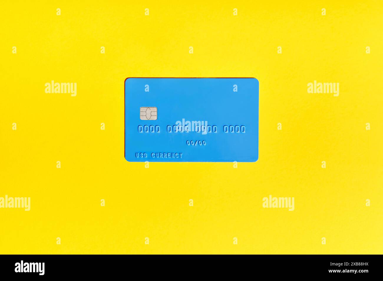 Blue credit card over yellow background. Money, finance, online ...
