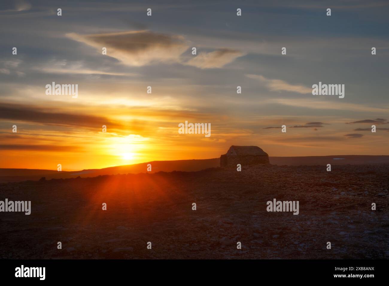 Sunrise over rocky desert landscape Stock Photo - Alamy