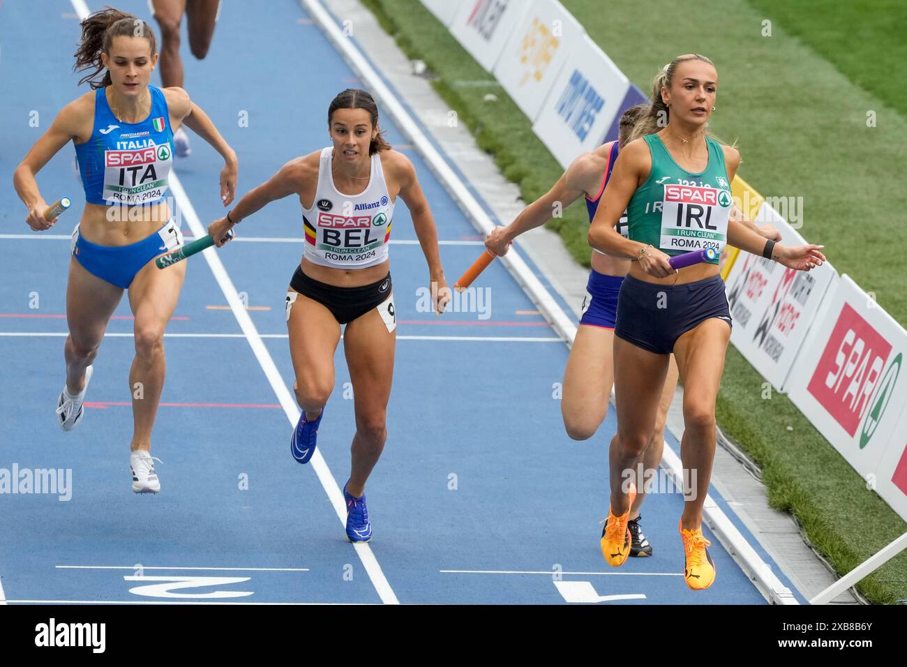 Ireland's Sharlene Mawdsley, right, crosses crosses the fish line of a ...