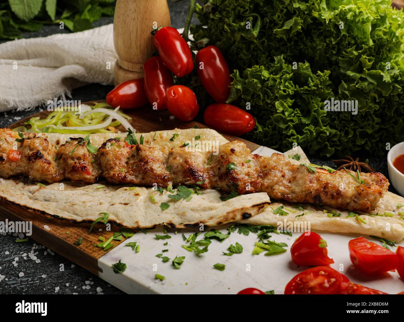 A table set with a delicious kebab platter of assorted meats and fresh ...