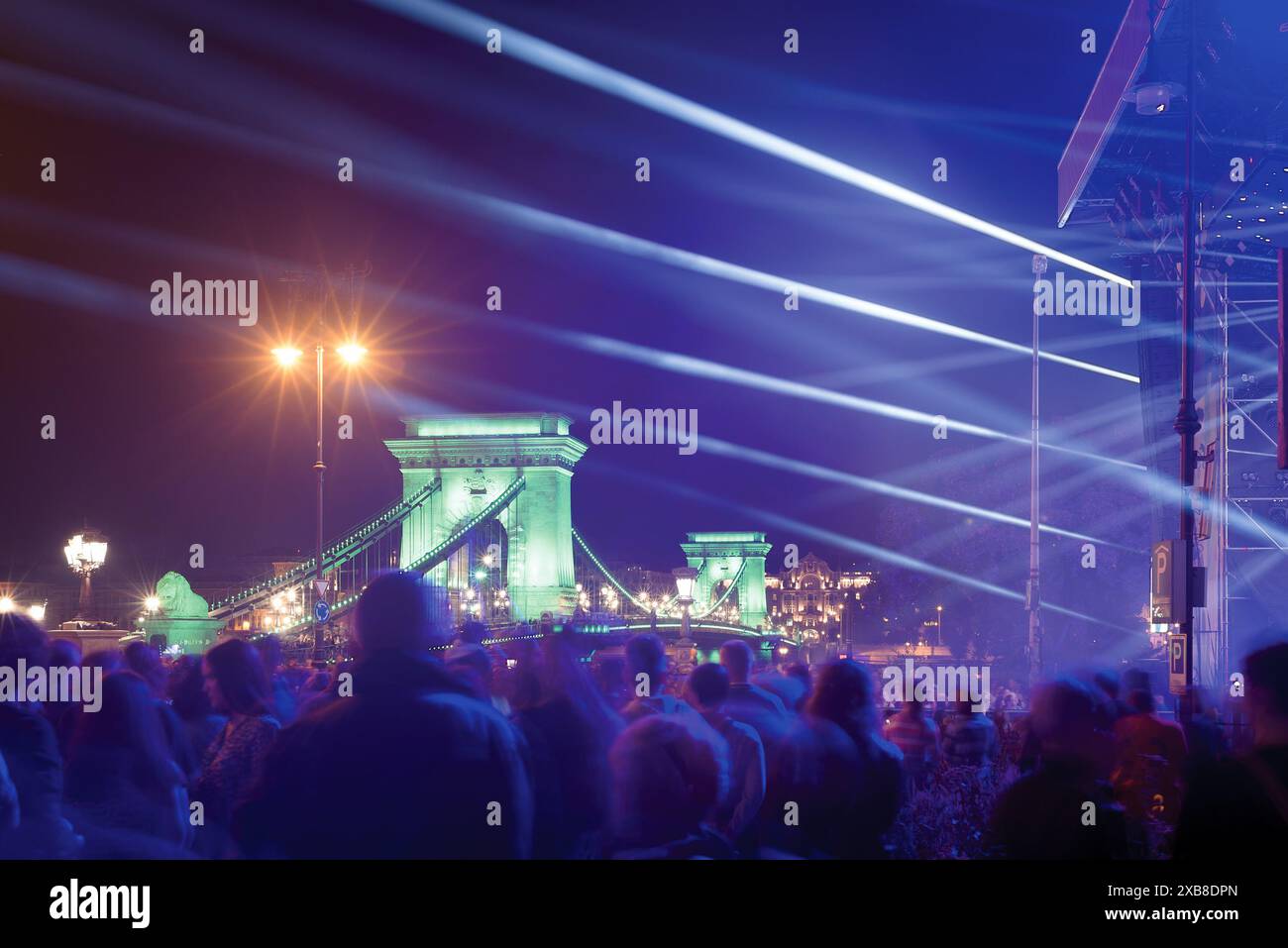 Night open air concert, light rays against Chain Bridge Stock Photo - Alamy