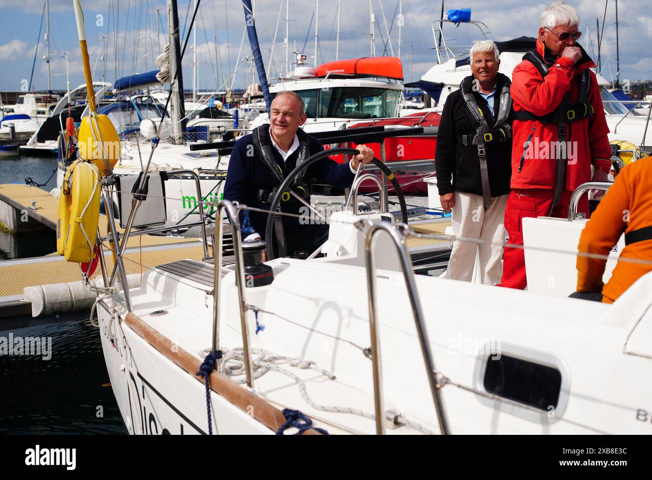 Liberal Democrats leader Sir Ed Davey (left) on board the Disabled ...