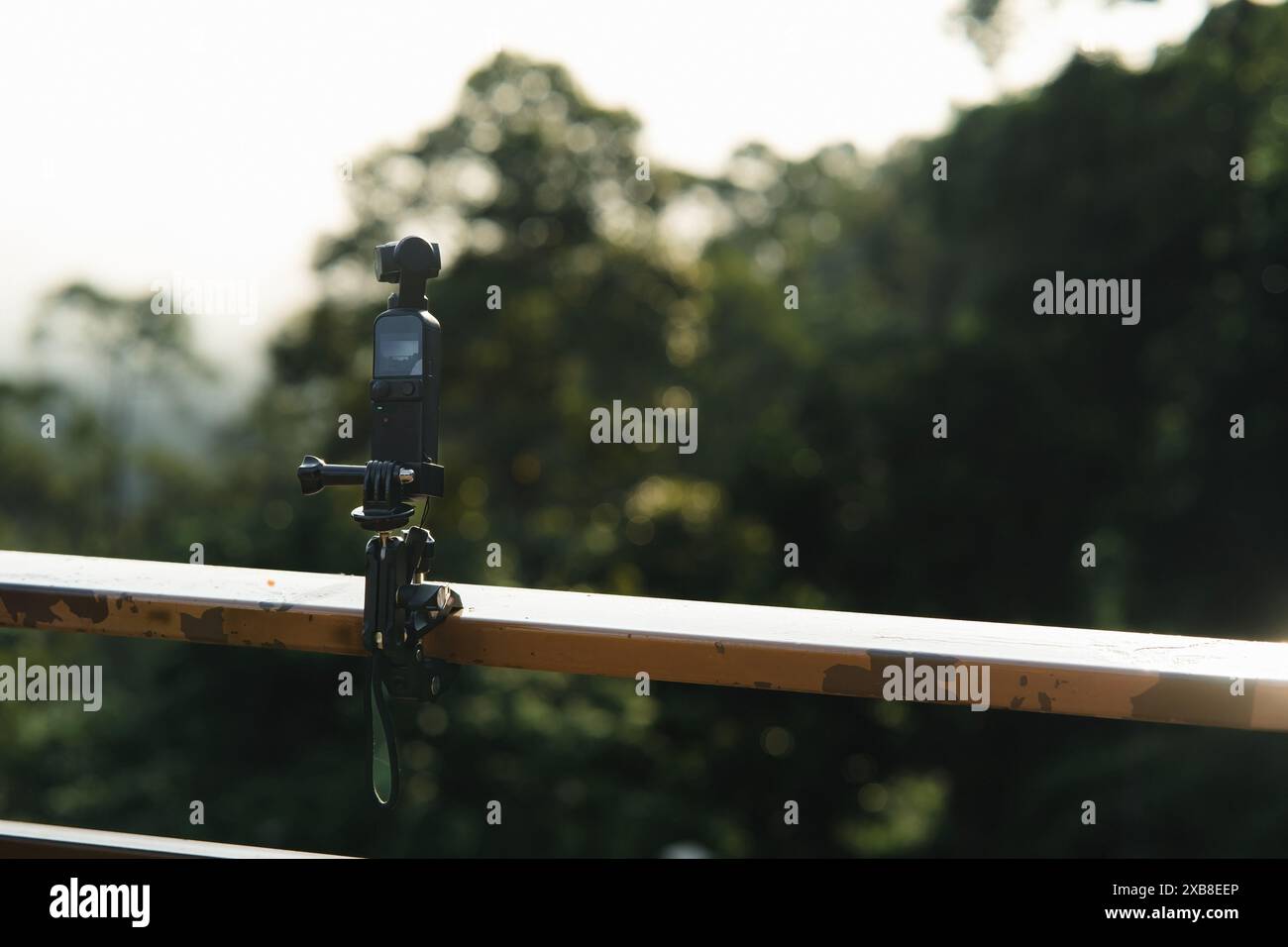 Gimbal camera on tripod attached to the metal bar, capturing time ...