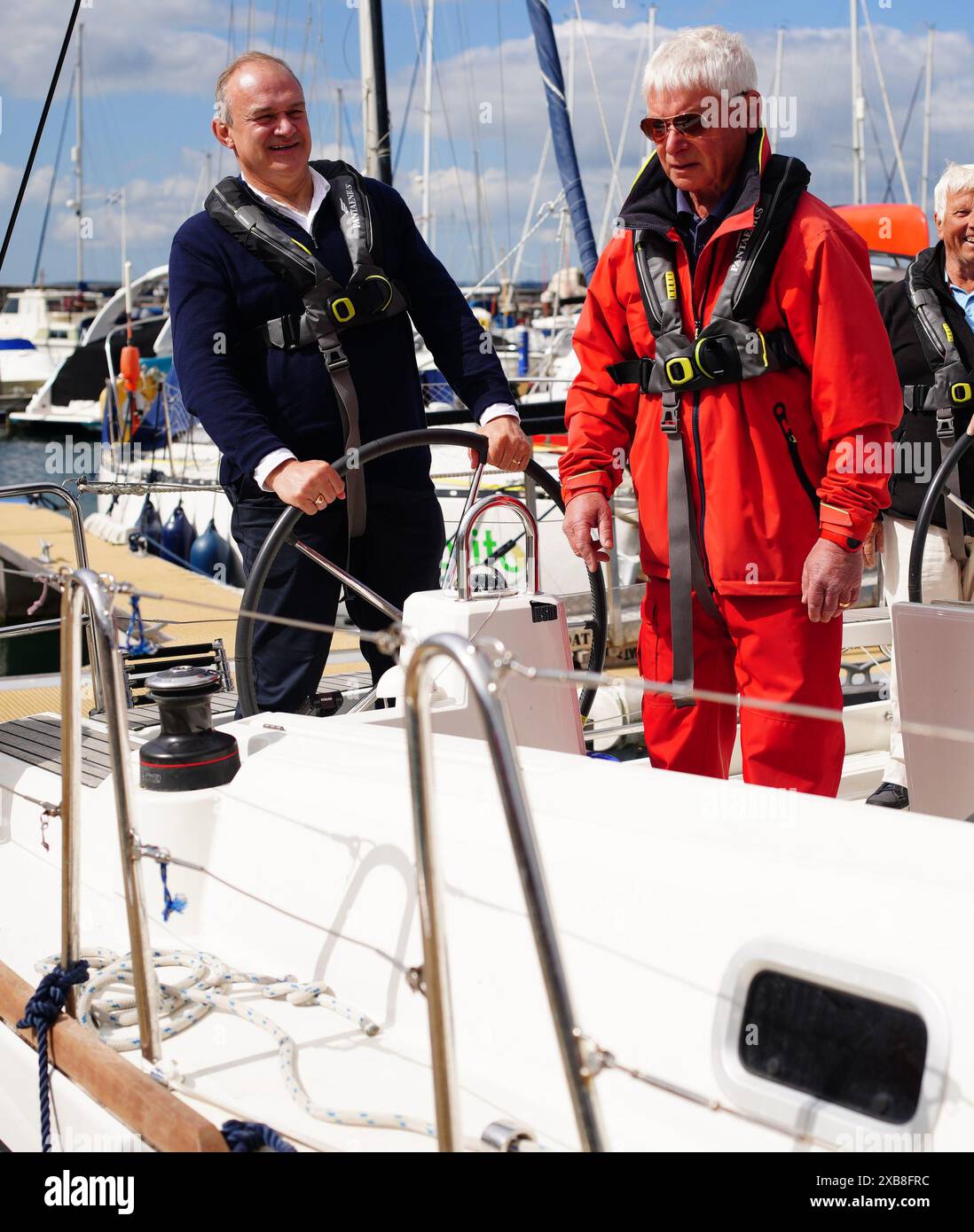 Liberal Democrats leader Sir Ed Davey (left) on board the Disabled ...