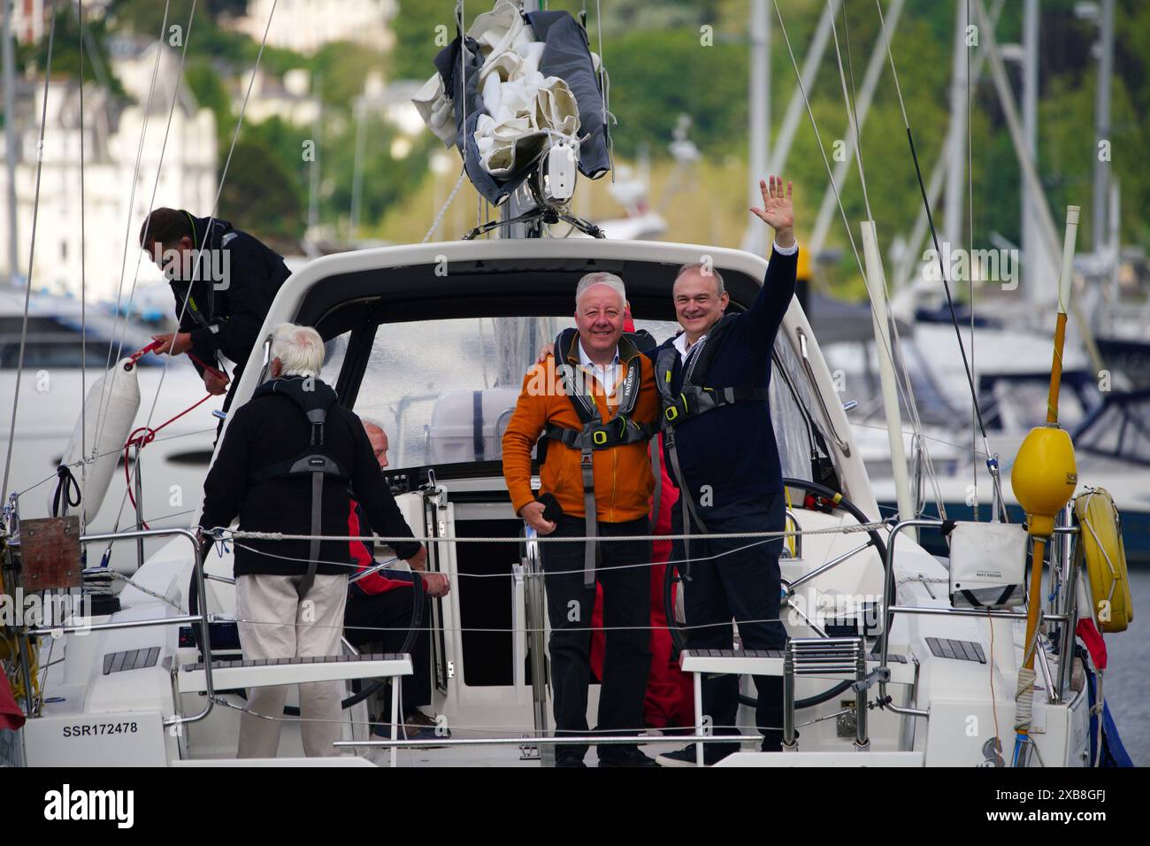Liberal Democrats leader Sir Ed Davey (right) on board the Disabled ...