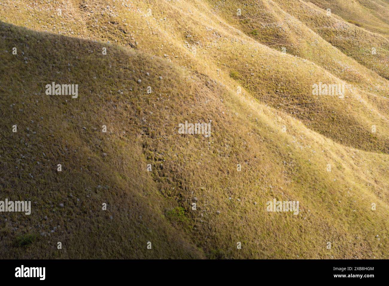 Aerial view of grassy mountain terrain Stock Photo - Alamy