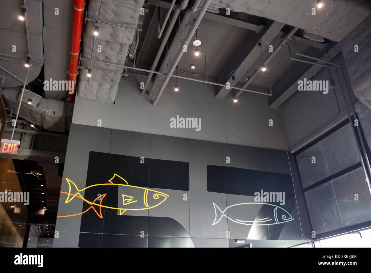 The neon fish signs adorn Google Pier 57 wall in New York City Stock ...