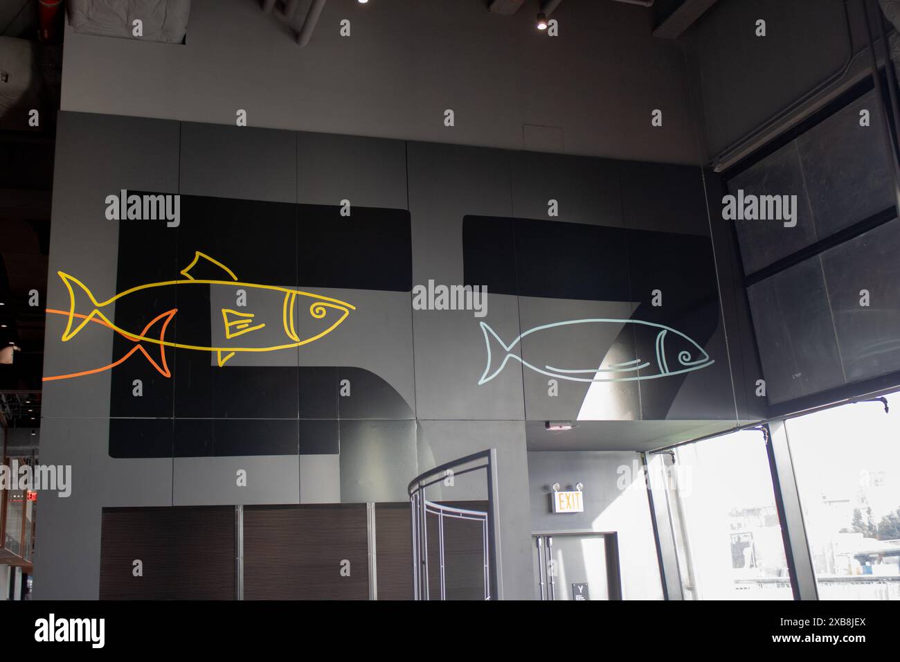 The neon fish signs adorn Google Pier 57 wall in New York City Stock ...
