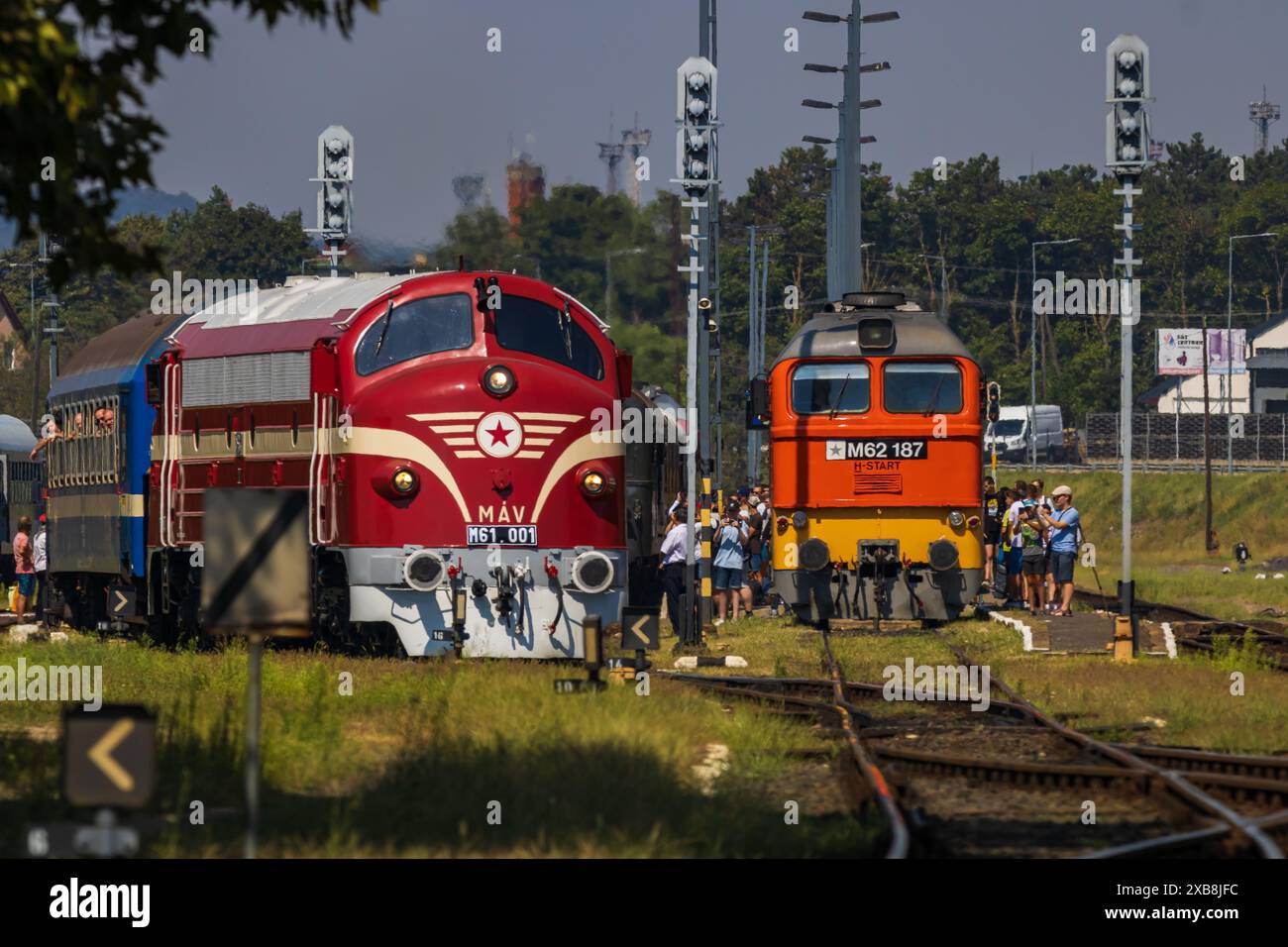 An M61 class locomotive leaves the station with its passenger train ...