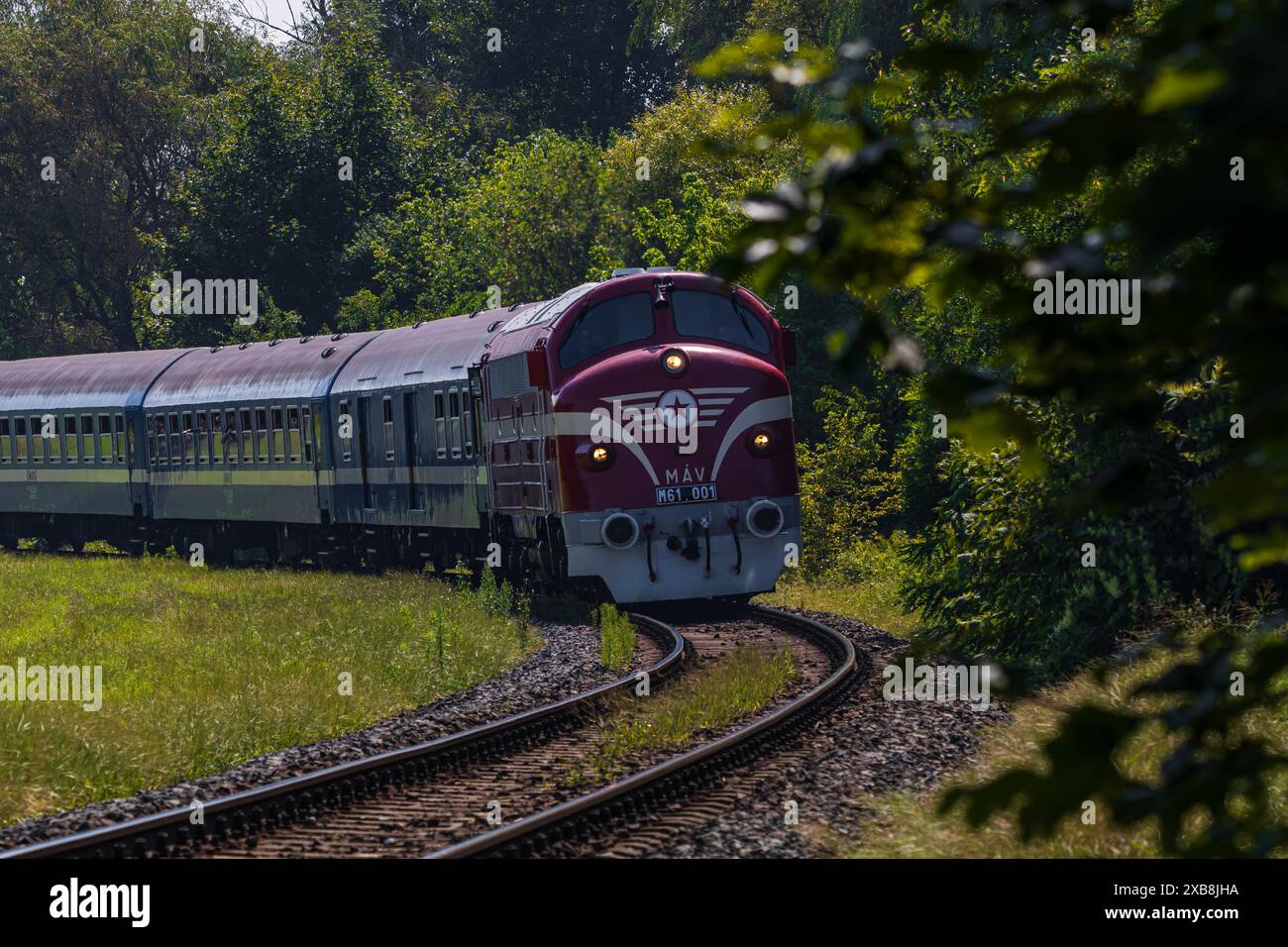 An M61 cass locomotive arrives from the station with its passenger ...