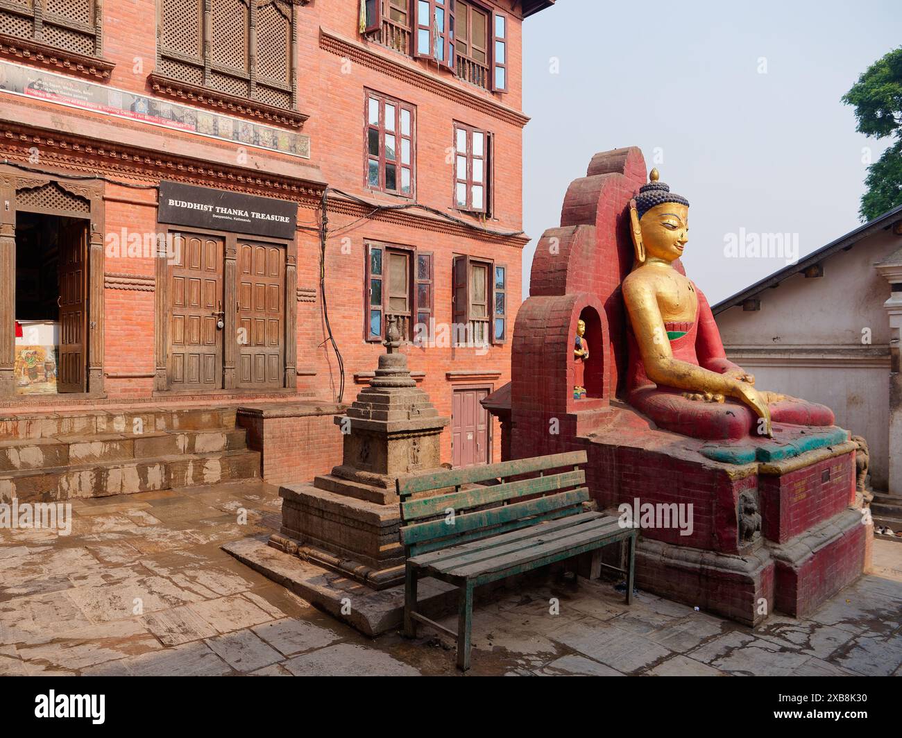 Intricate sculpture in front of historic structure Stock Photo - Alamy
