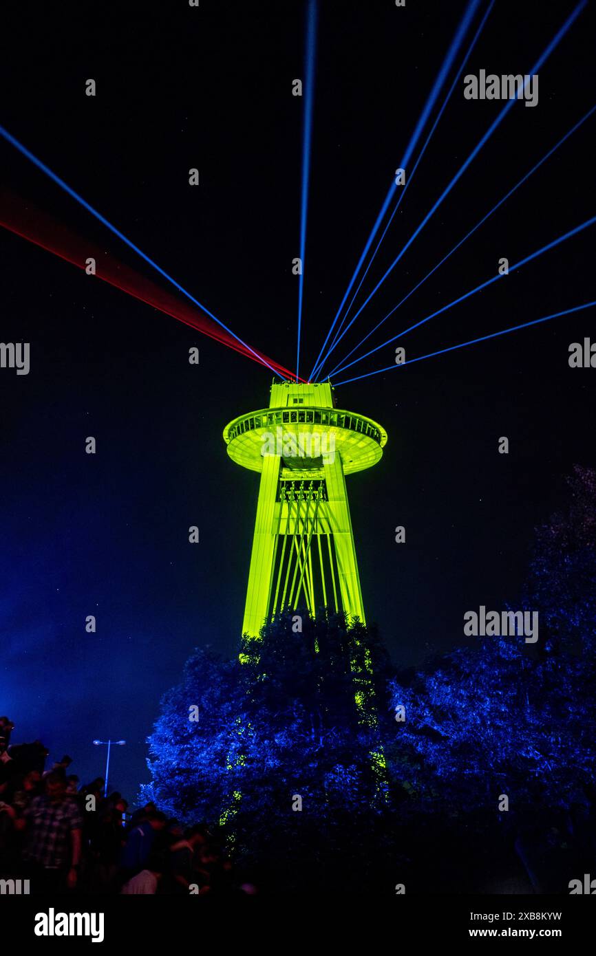 A colorful tower emitting light beams Stock Photo - Alamy