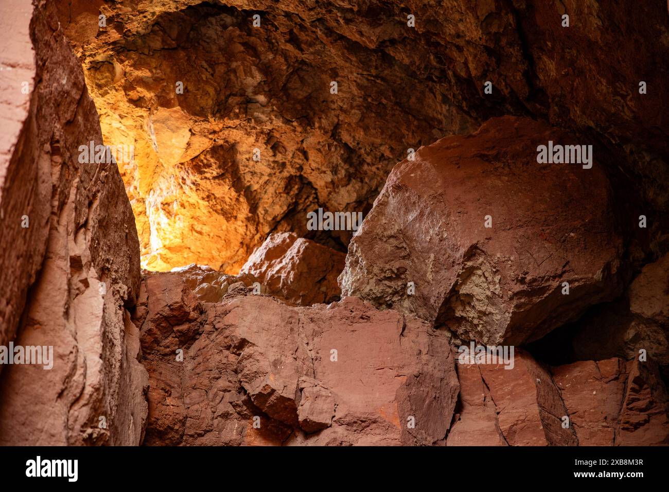 A Rocky cave covered in soil and stones Stock Photo - Alamy