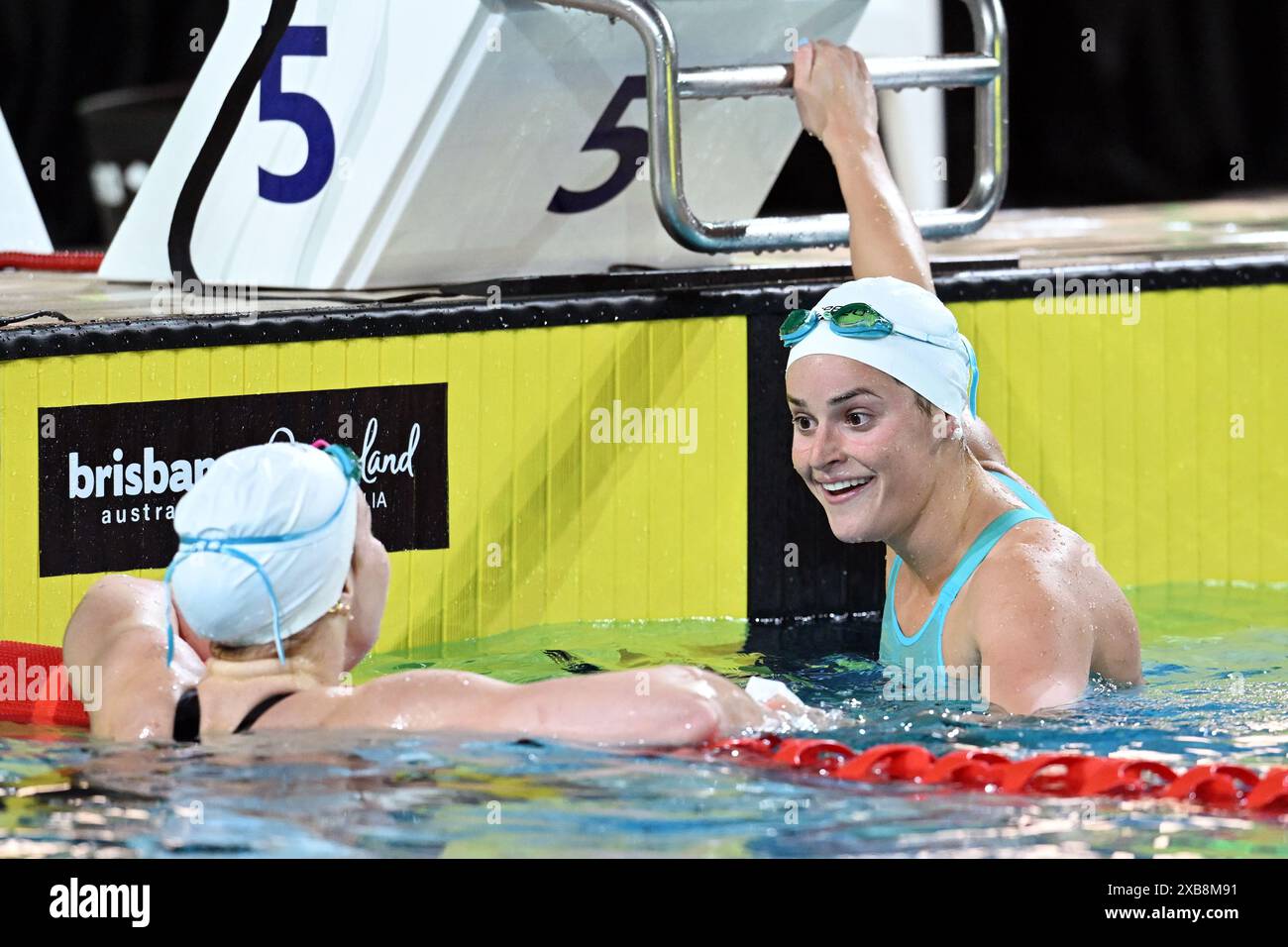 Brisbane, Australia. 11th June, 2024. Kaylee McKeown (right) reacts ...
