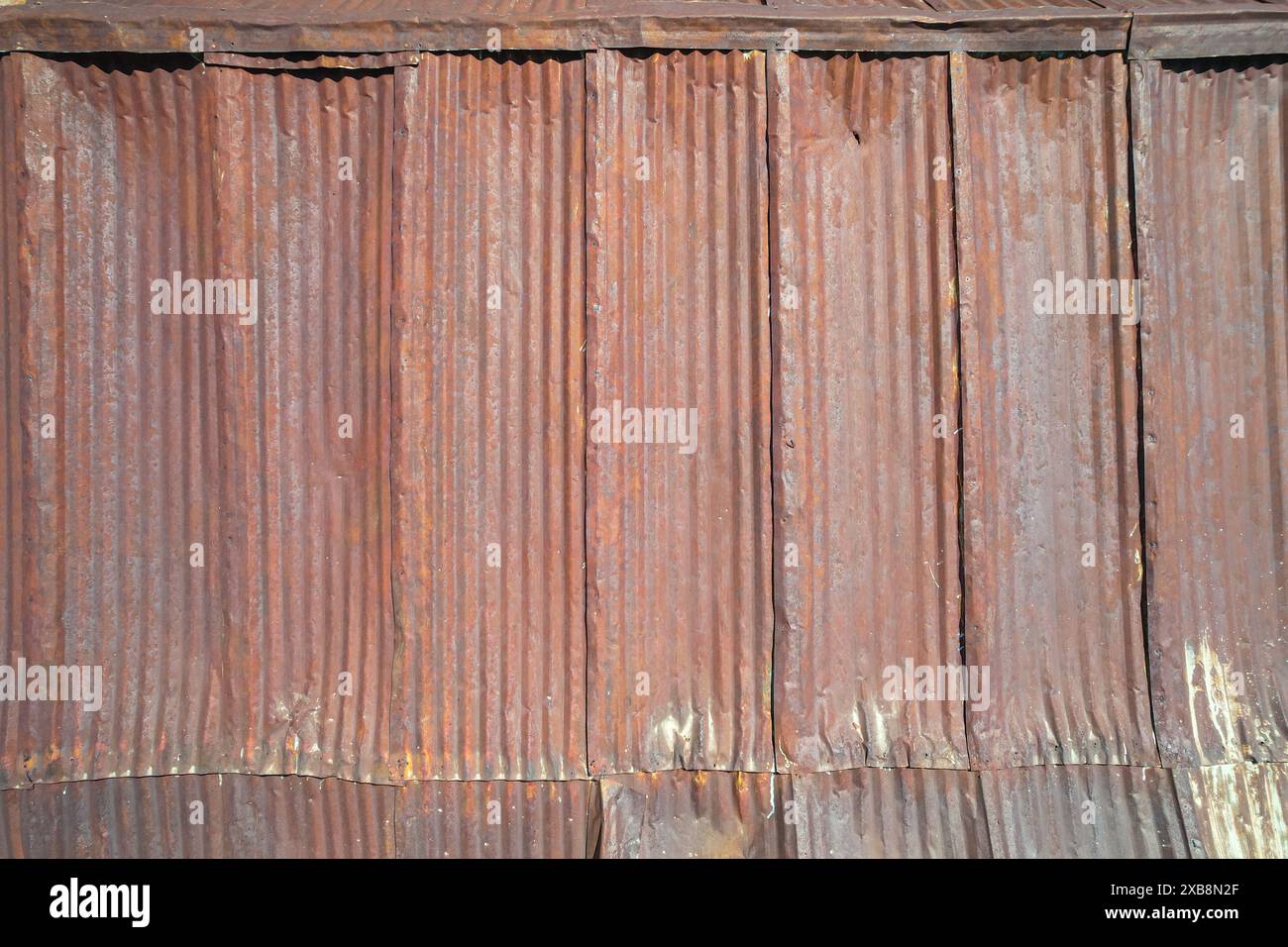 Rusted tin roofing sheets from an abandoned mining ghost town take on a ...