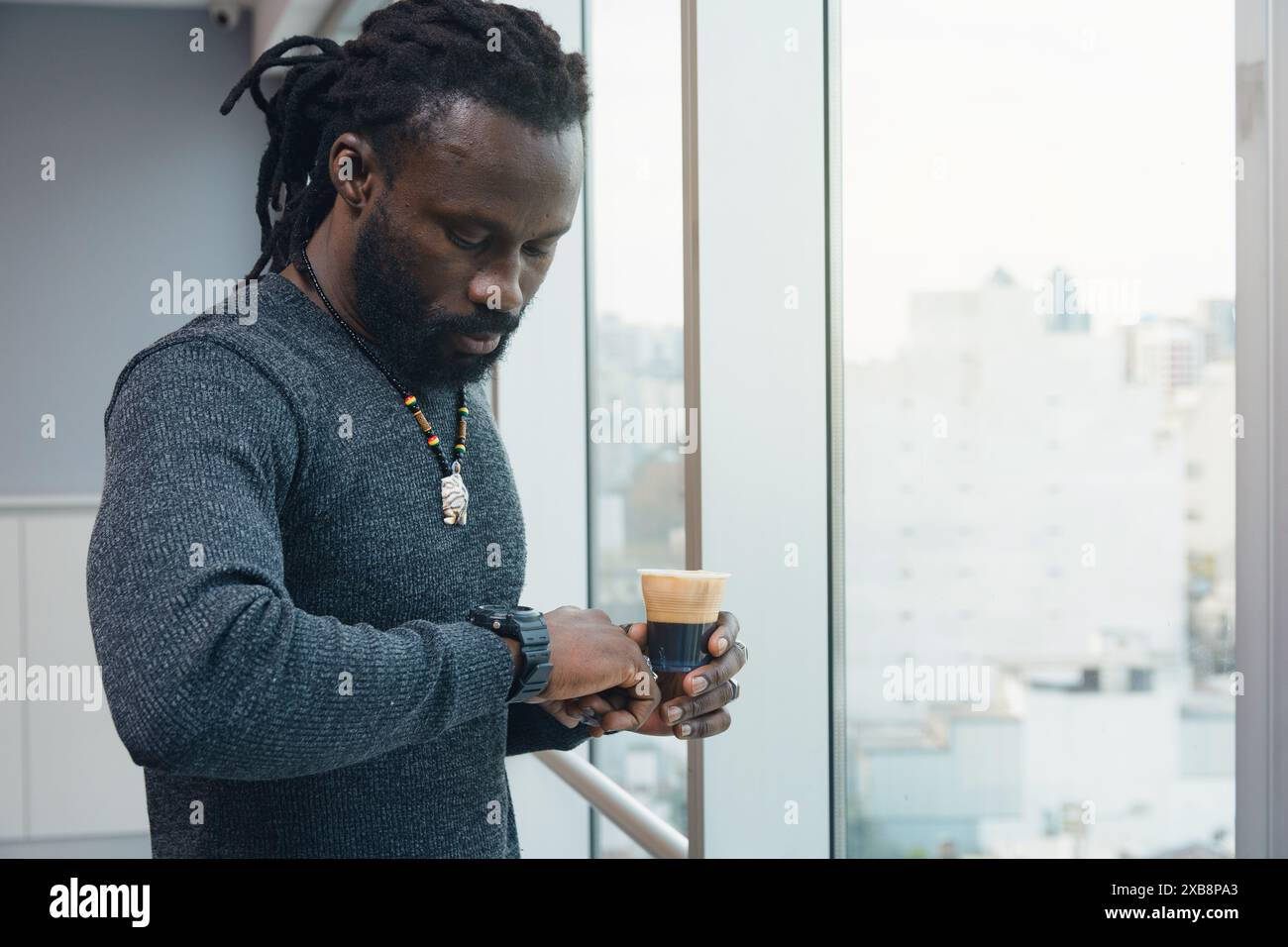 African Entrepreneur Man with dreadlocks in co-working space is ...