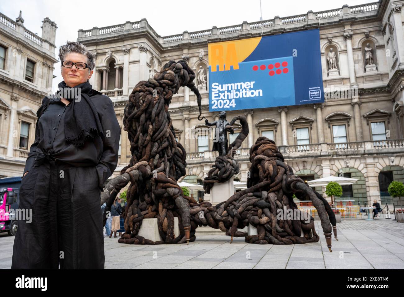 London, UK. 11 June 2024. Artist Nicola Turner with her sculpture 'The Meddling Fiend', seen in ...