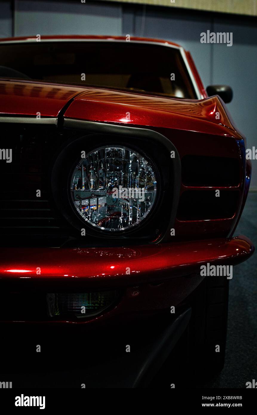 Shiny red car with lights illuminated Stock Photo - Alamy