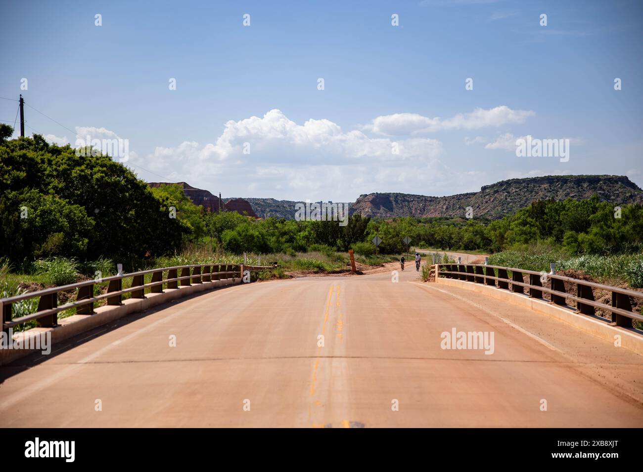 Desert street bridge with distant mountains Stock Photo - Alamy