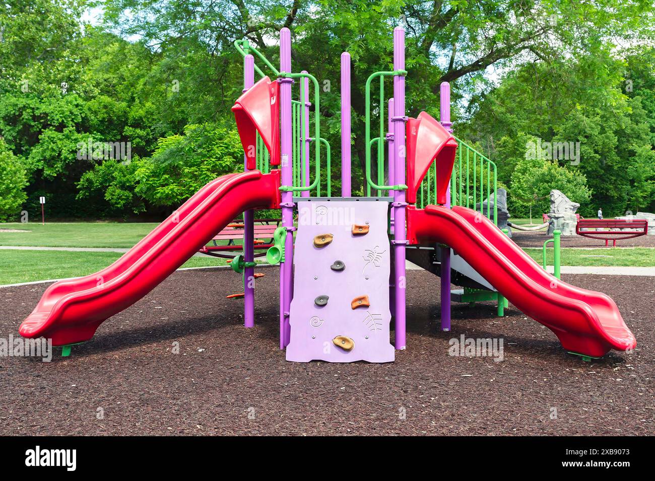 A colorful playground slide on sandy park grounds for children Stock ...