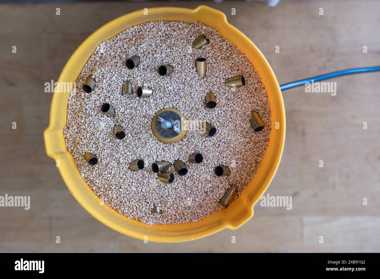Vertical view of a vibrating tumbler with walnut shell grain cleaning ...