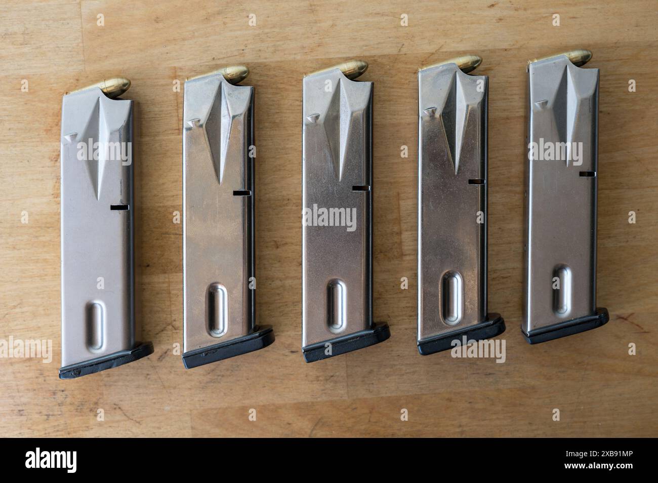 Detail of 5 9mm pistol magazines. The magazines are fed with bullets ...