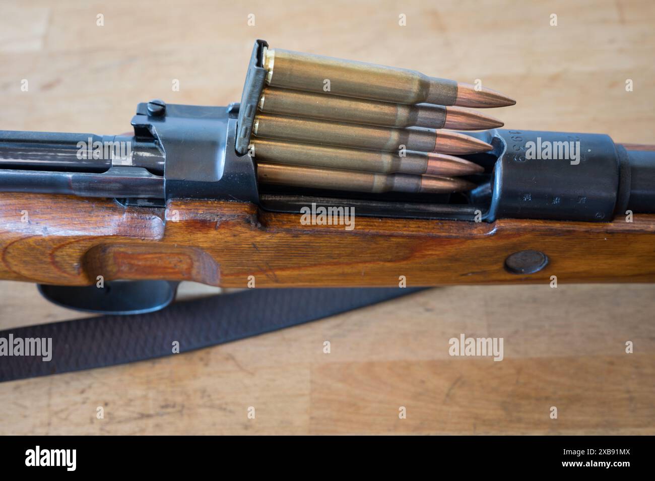 Detail of the insertion of an ammunition clip with 5 30-06 caliber ...