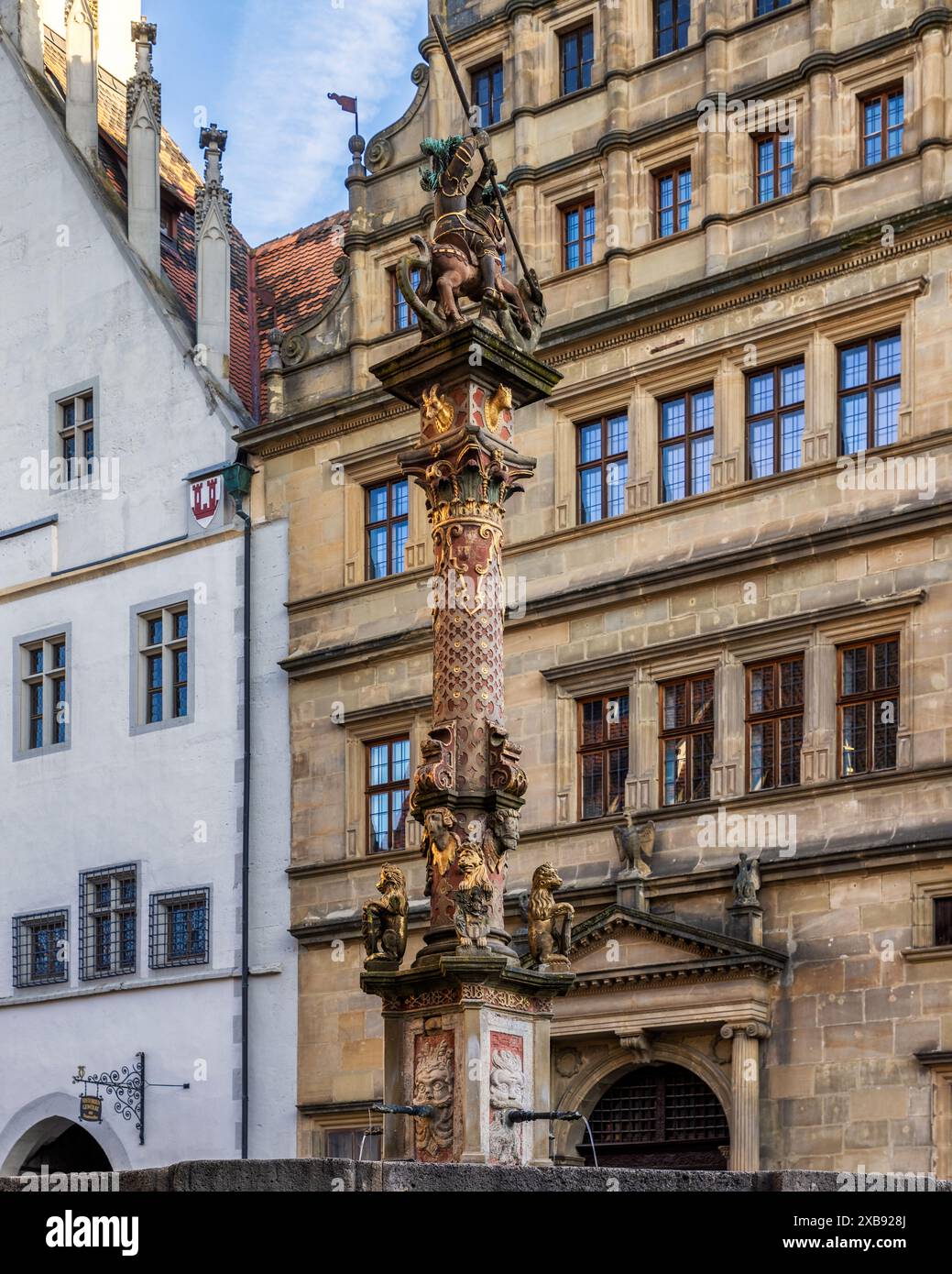 The view of St George fountain in the market square of Rothenburg ob ...