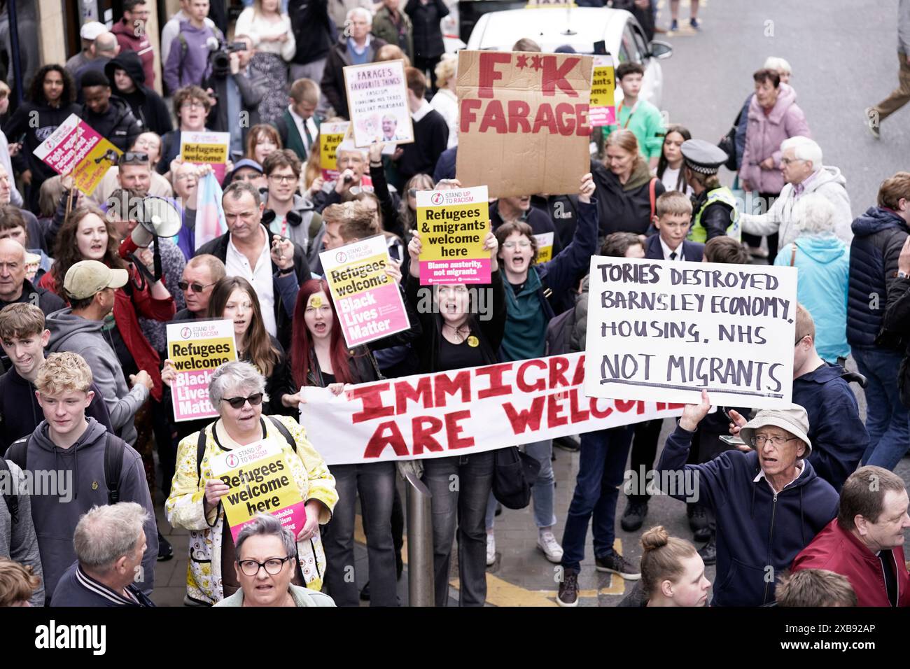 EDITORS NOTE LANGUAGE ON PLACARD People demonstrate as Reform UK leader ...