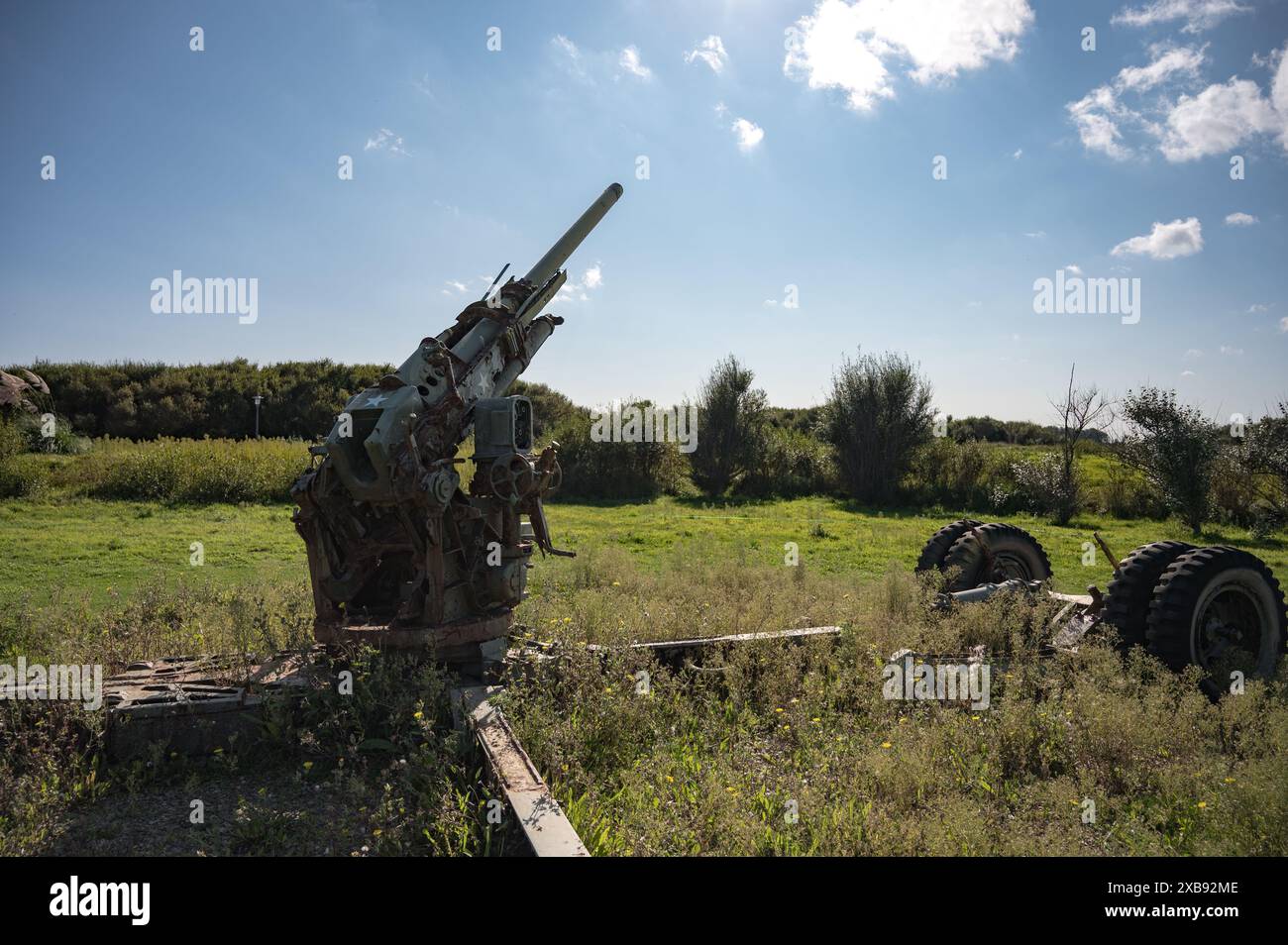 An old anti-aircraft gun from the Second World War, in a field in ...