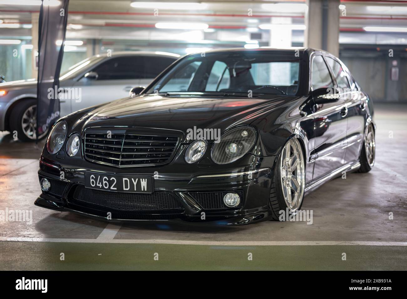 A German Mercedes Benz E Class E320 CDI W211, black in Russian mafia style Stock Photo - Alamy