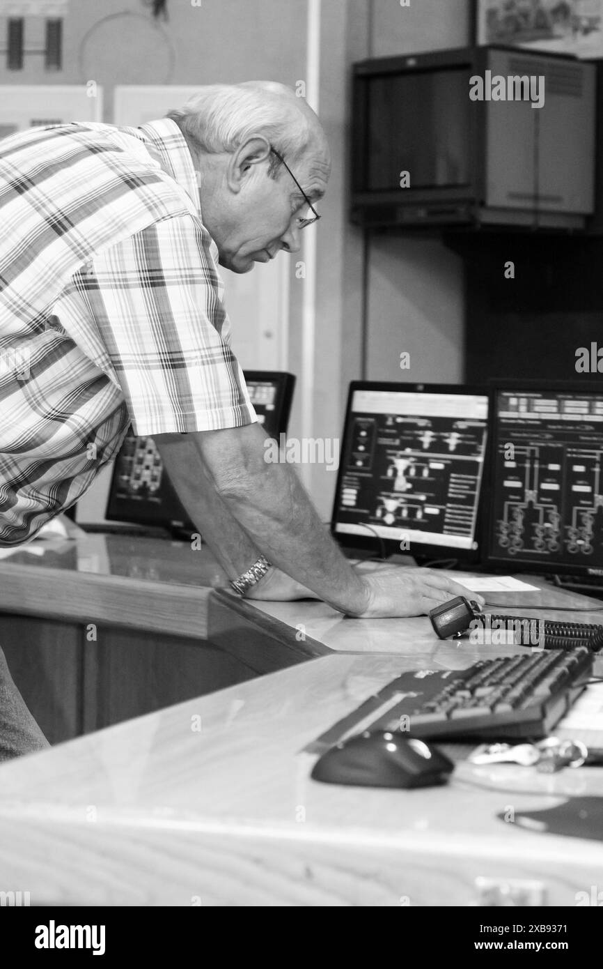 Hunched over desk hi-res stock photography and images - Alamy