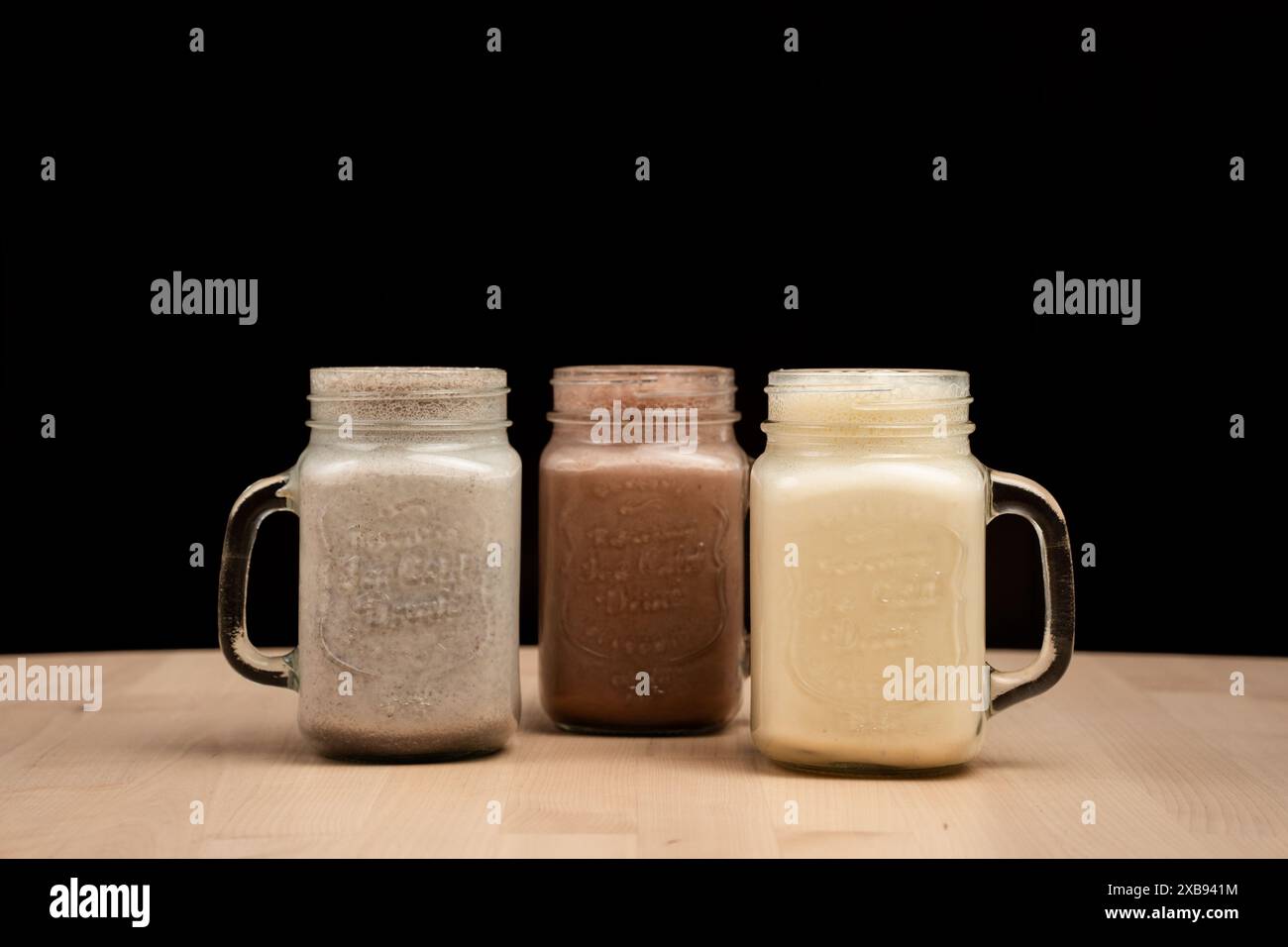 Three jars filled with colorful liquid Stock Photo - Alamy