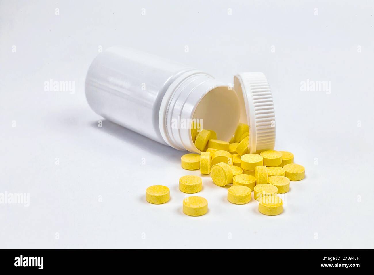 pill of folic acid in a jar on a white background Stock Photo - Alamy