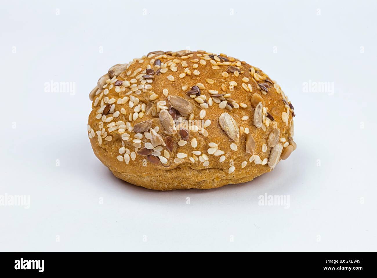 Rye bun seeded on a white background Stock Photo - Alamy