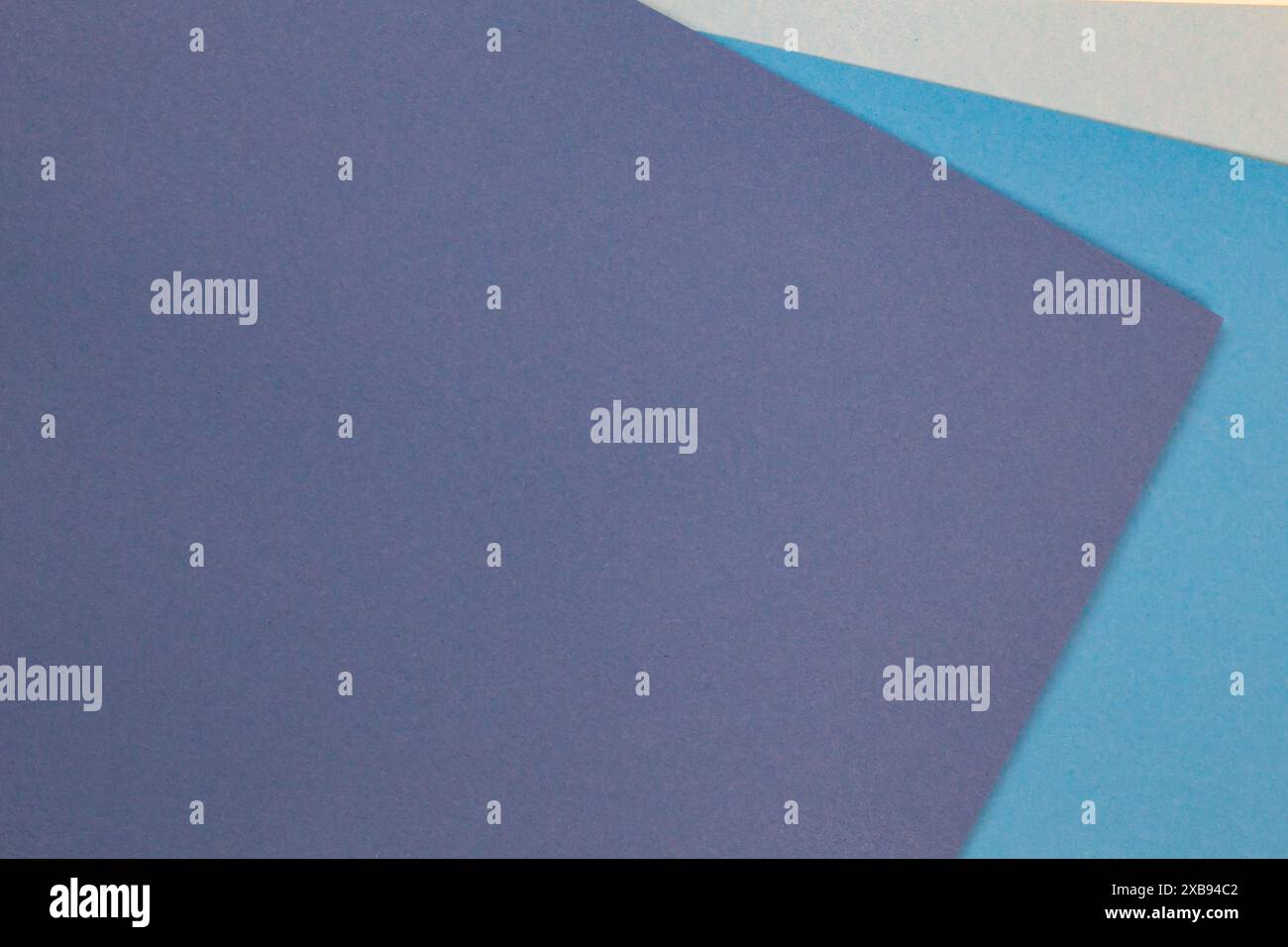 sheets of colored paper. Many colored sheets of paper are laid out in ...