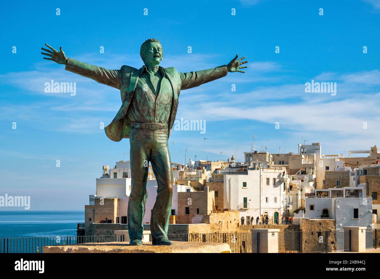 Statue of Domenico Modugno on the lungomare, Polignano a Mare, Italy ...
