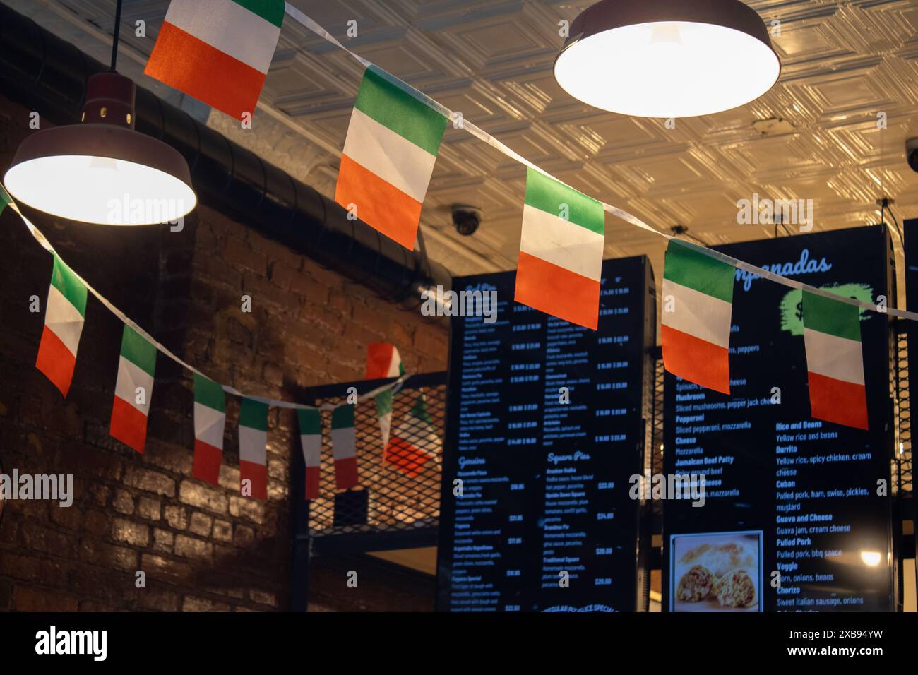 Multiple flags drape from ceiling in a restaurant Stock Photo - Alamy