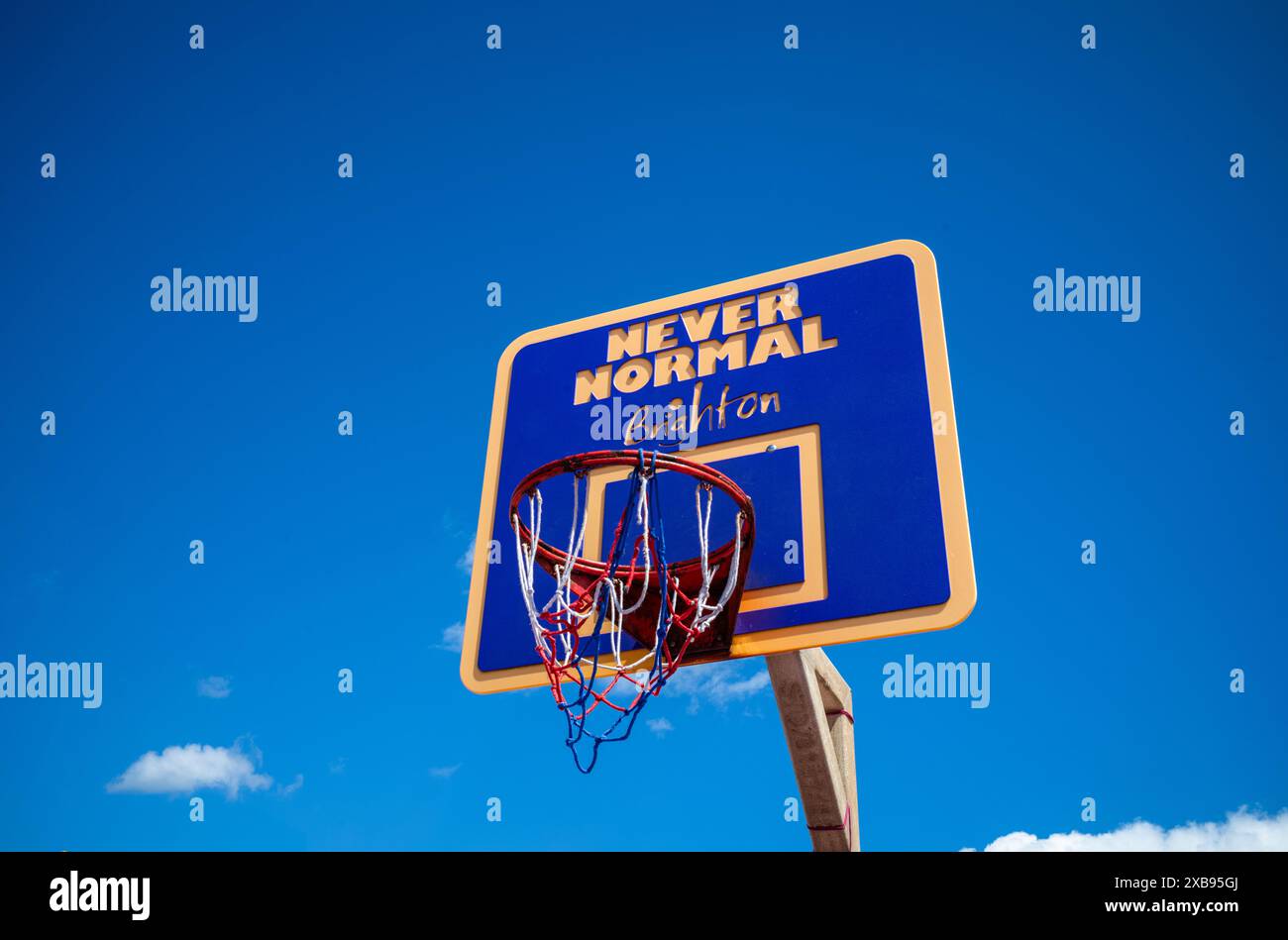 A basketball hoop with the words "Never Normal" and Brighton on the ...