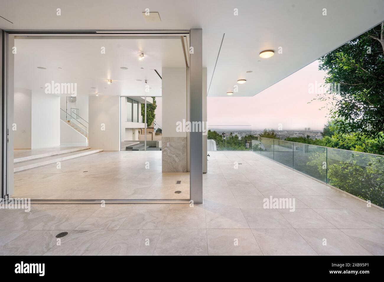 A modern white balcony with glass door and window above Stock Photo - Alamy