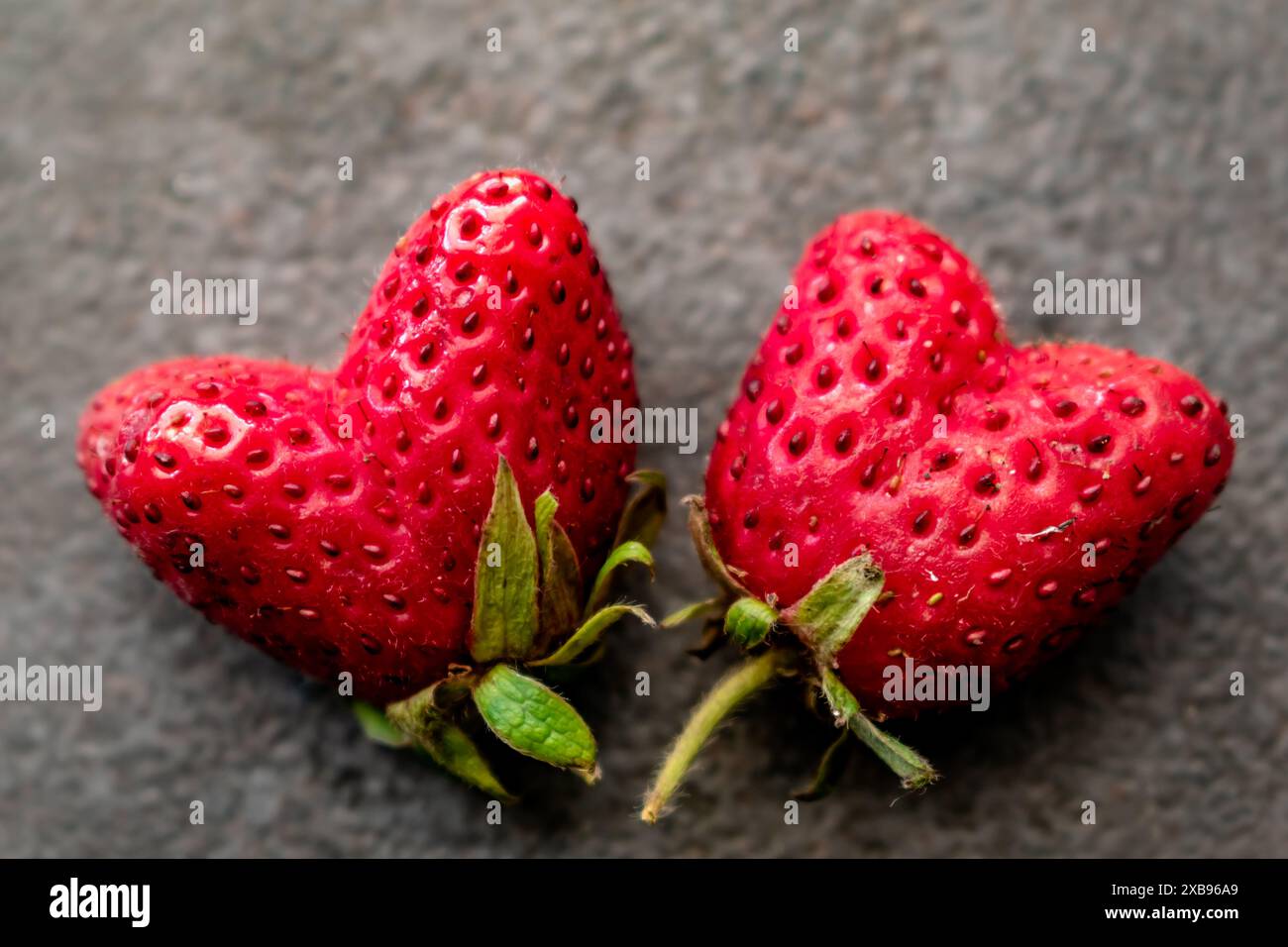 Funny heart shaped strawberry, fragaria, fragum Stock Photo - Alamy