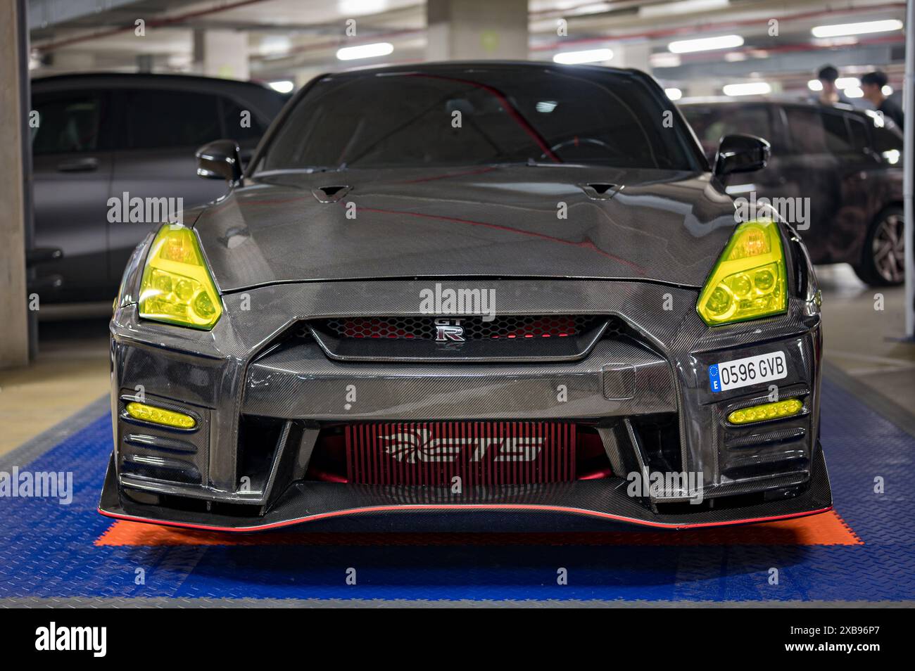 Impressive Japanese sports car Nissan GT-R R35 in dark color with ...