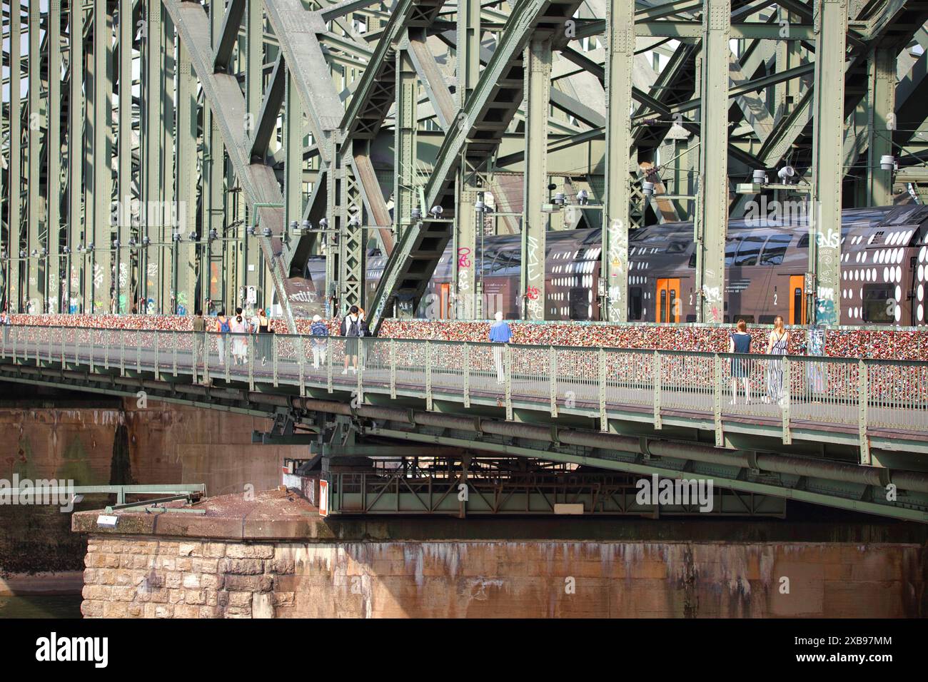 A train bridge with multiple trains passing over it Stock Photo - Alamy