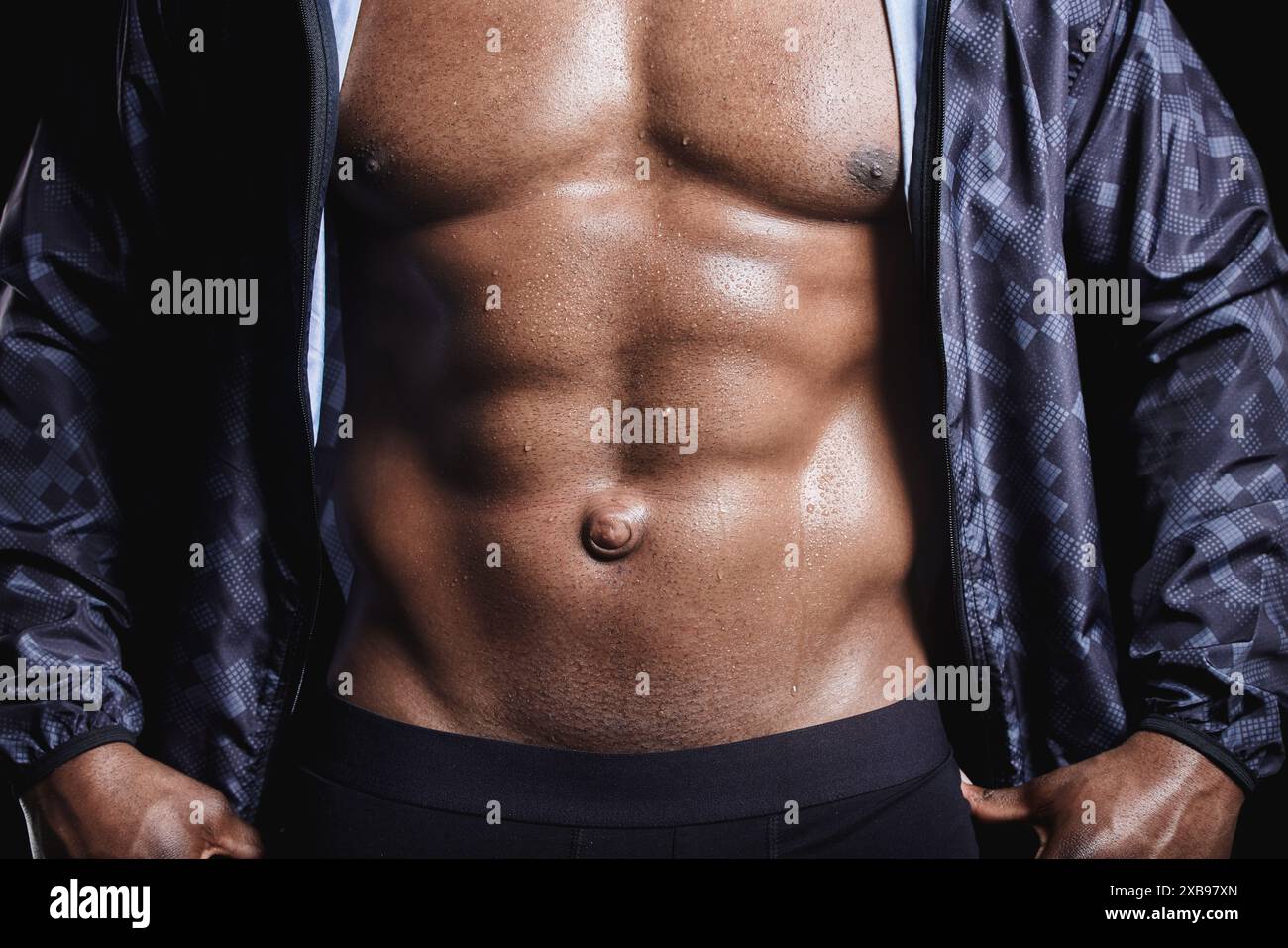 Black man, muscle and abdomen in studio for exercise, strong ...