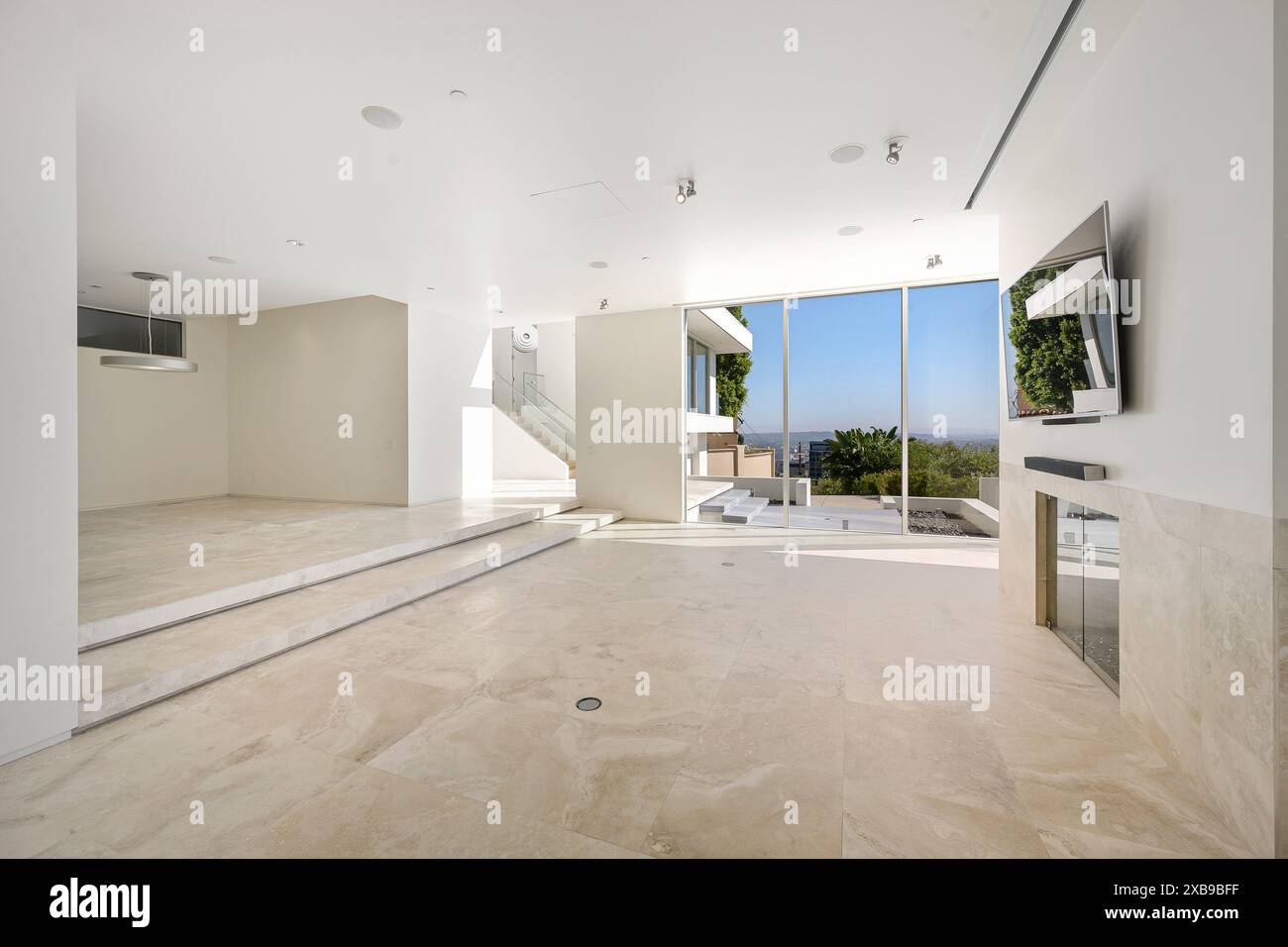 A Living room with ocean view through large window Stock Photo - Alamy
