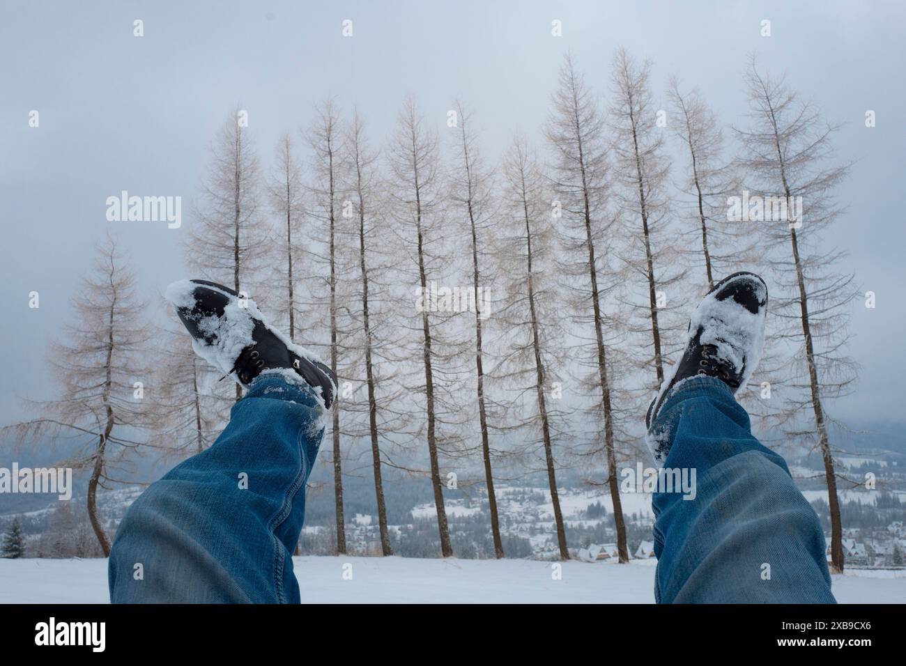 winter landscape with legs of a man Stock Photo - Alamy