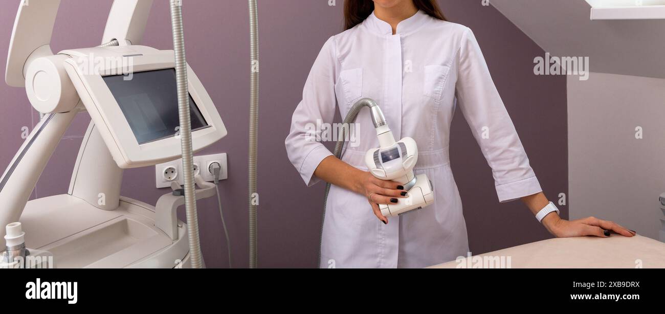 Doctor woman posing with LPG machine for getting beauty therapy against ...