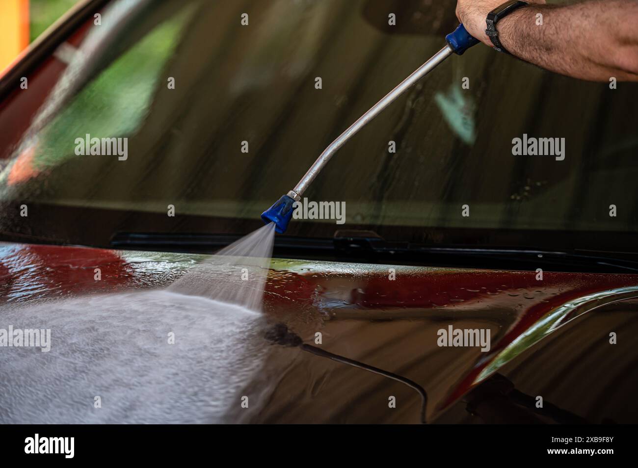 Manual car wash with pressurized water in car wash outside. Summer Car ...