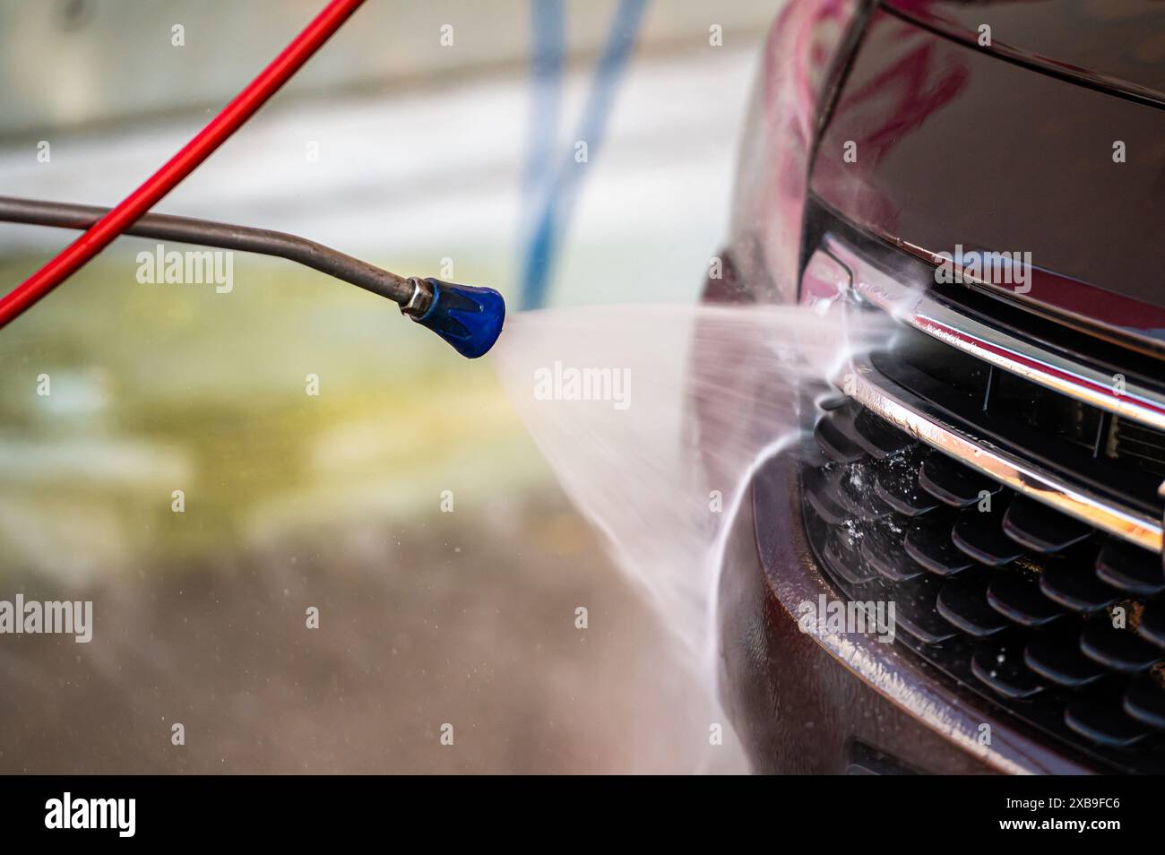 Close-up car washing with high pressure car washer spray gun Stock ...